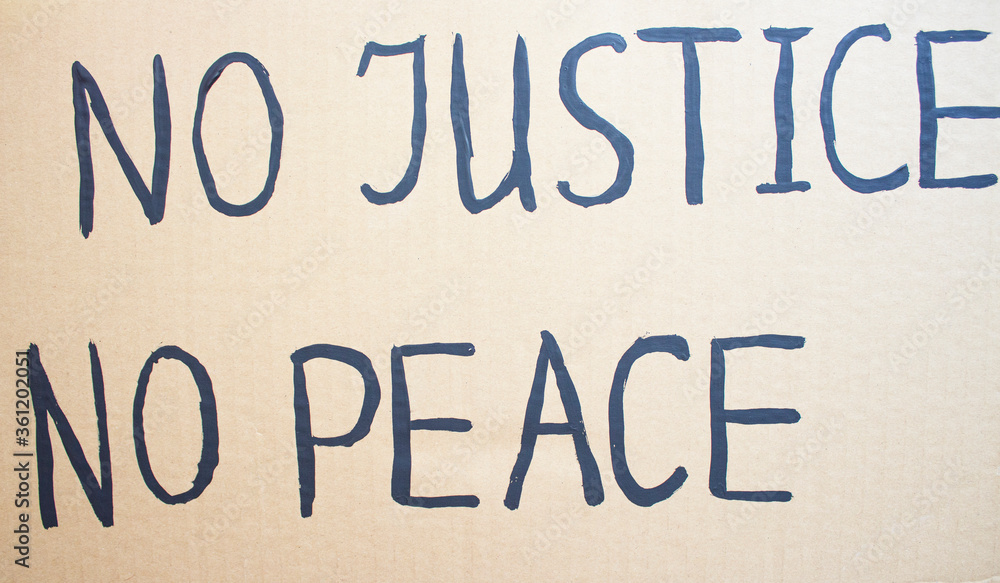 NO JUSTICE NO PEACE. Text message for protest on cardboard. Stop racism ...