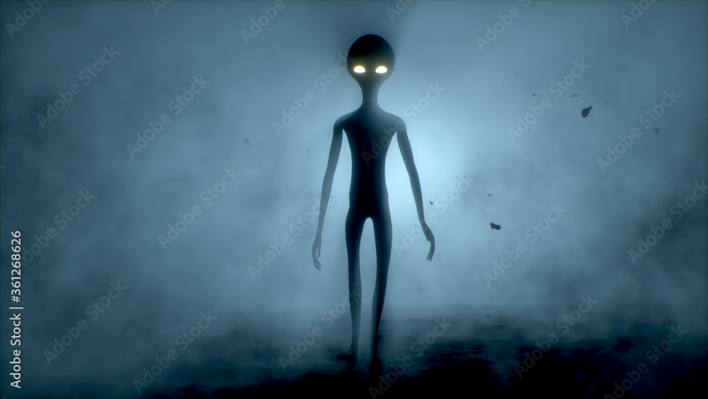 Scary gray alien walks and looks blinking on a dark smoky background ...