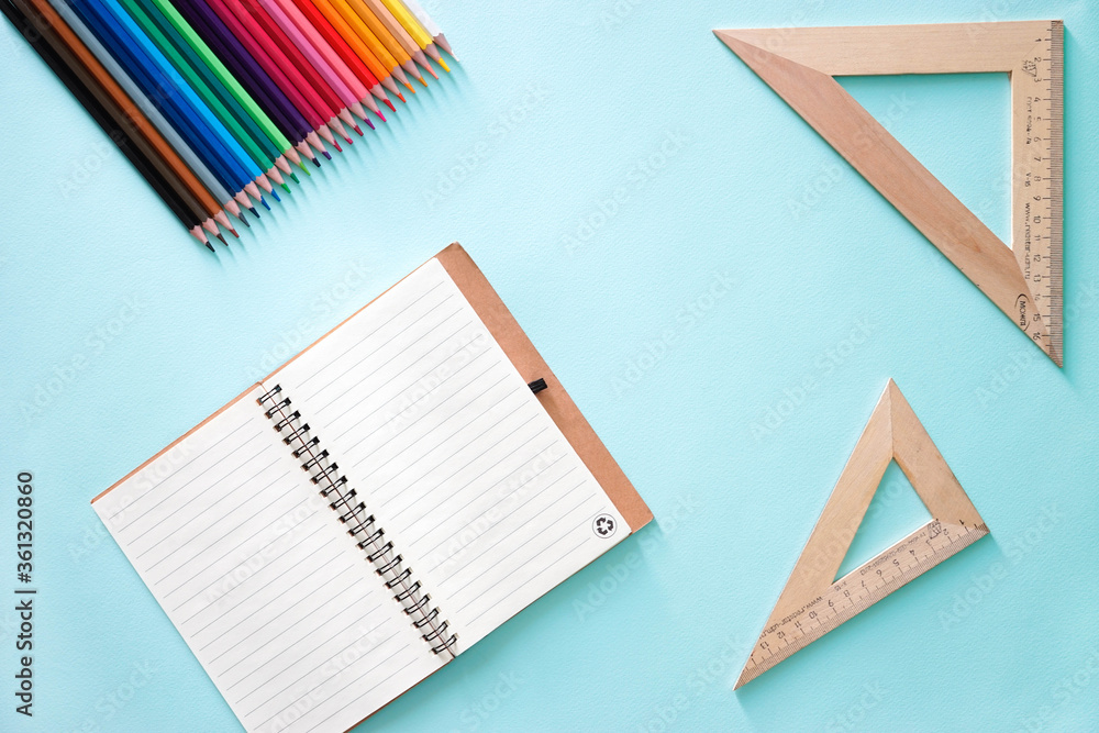 flat lay composition with Clear sheet note book, two wooden rulers ...