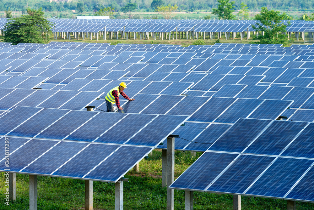Engineer working and checking at solar power station,Climate change and ...