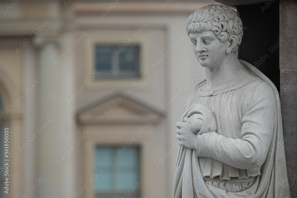 Statue of beautiful Roman noble man at the obelisk in the Old Market ...