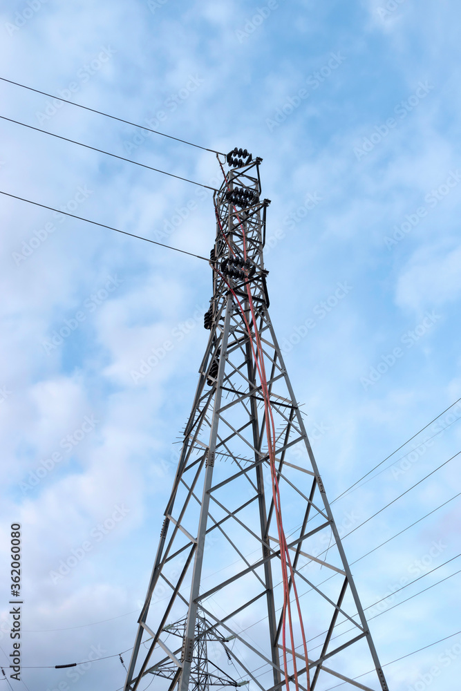 High voltage power transmission tower. Power tower with cloud ...