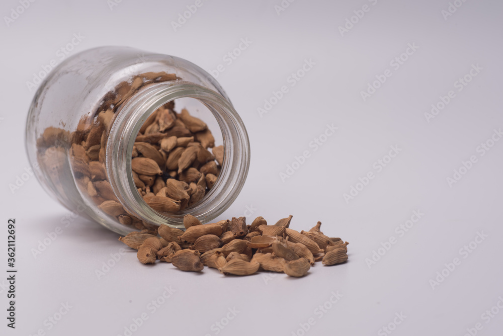 Cardamom inside a see through a jar,over white background Stock Photo ...