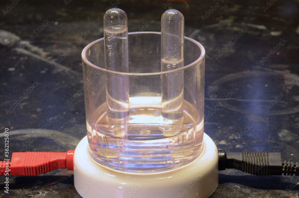 Electrolysis of water. Hydrogen is created at the negative electrode ...