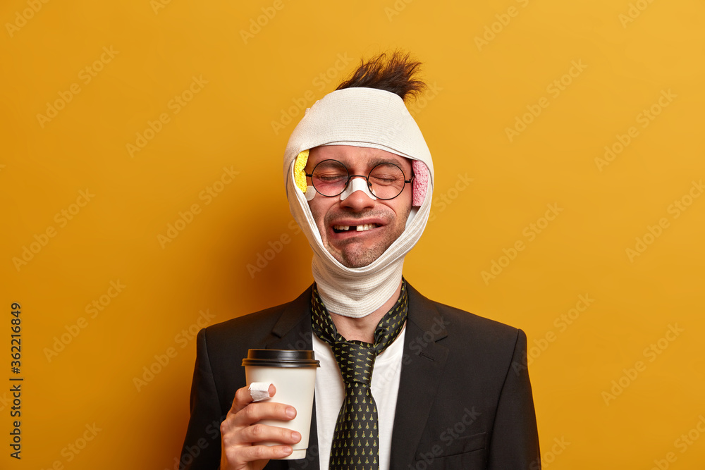 Photo Stock Crying European man has broken teeth, wears adhesive tape ...
