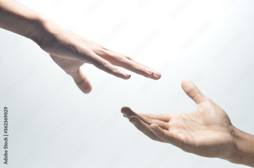 Two People Reaching For Each Other