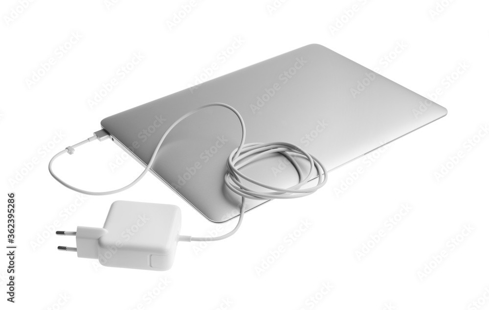 Laptop and charger on white background. Modern technology Stock Photo ...