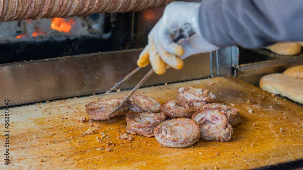 Skewered lamb intestines. Lamb's/sheep's intestines grilled on a spit ...
