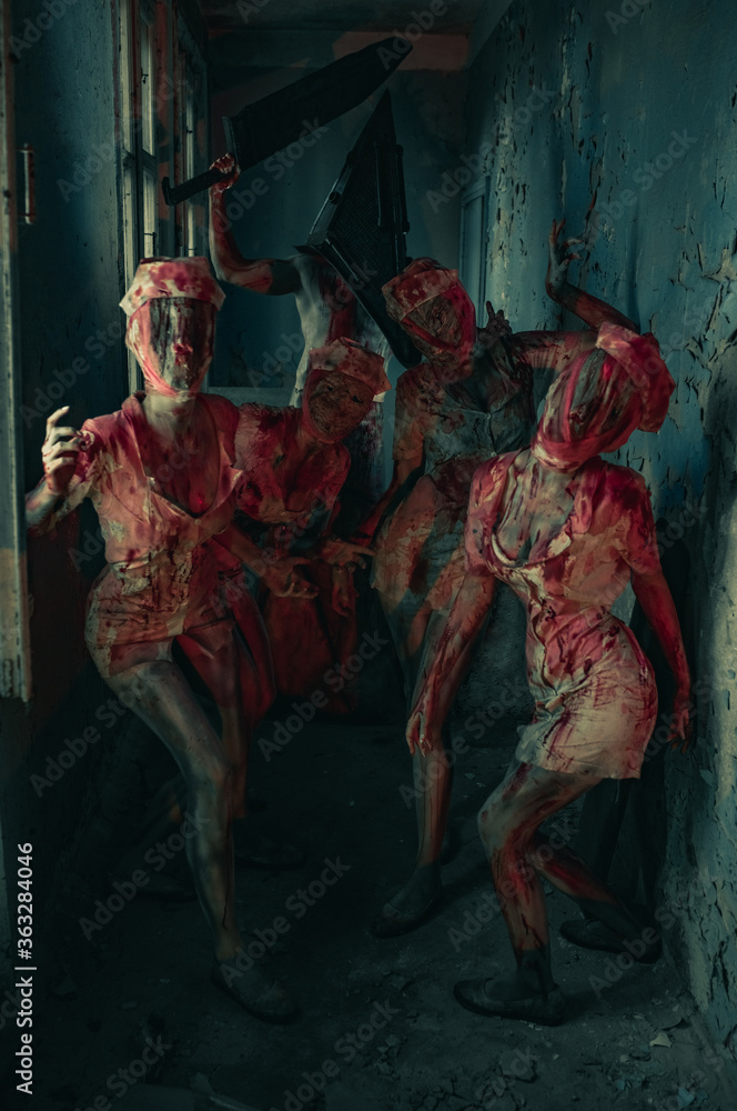 Cosplayers are in the image of bloody monsters and executioner. Stock ...