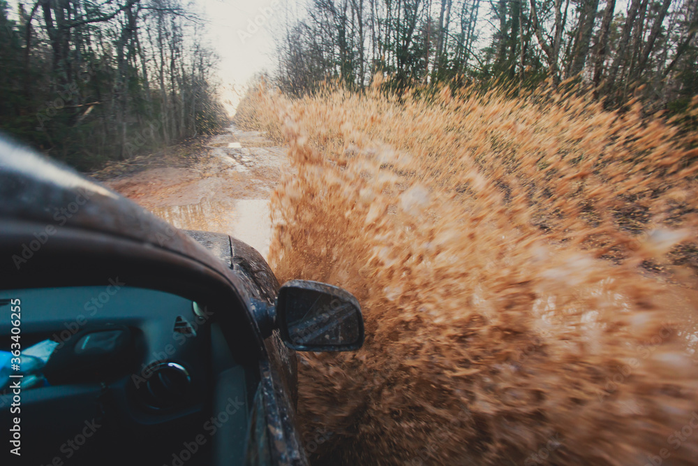 Photo Stock Suv offroad 4wd car rides through muddy puddle, off-road ...