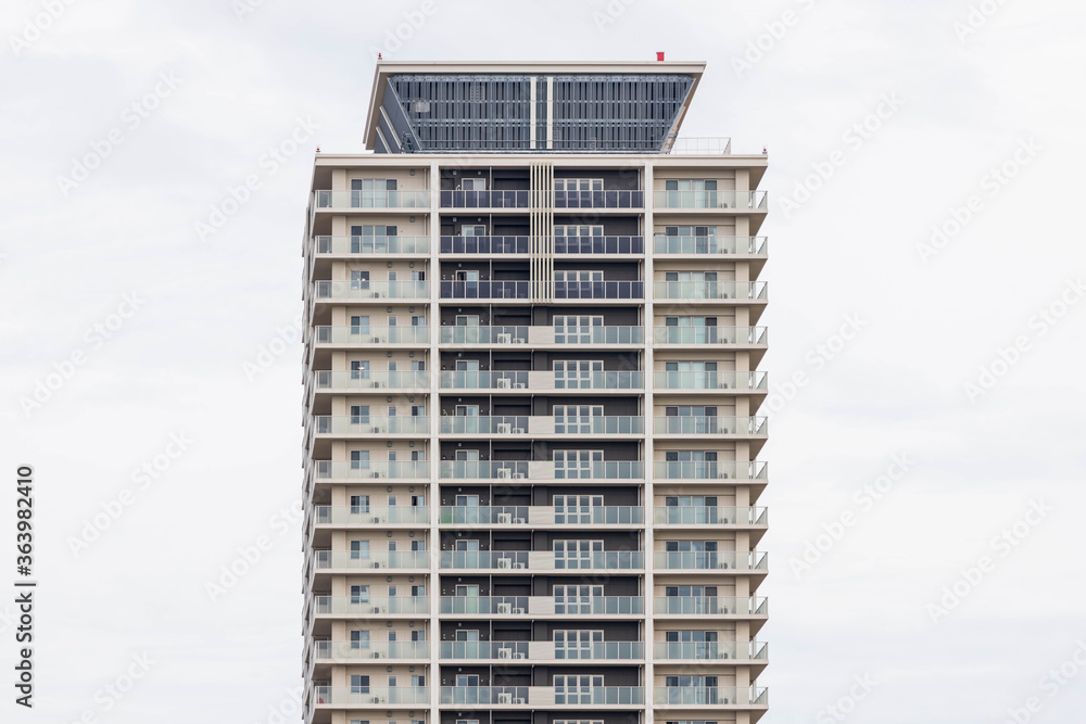 Tall apartment building with helipad on roof Stock Photo | Adobe Stock