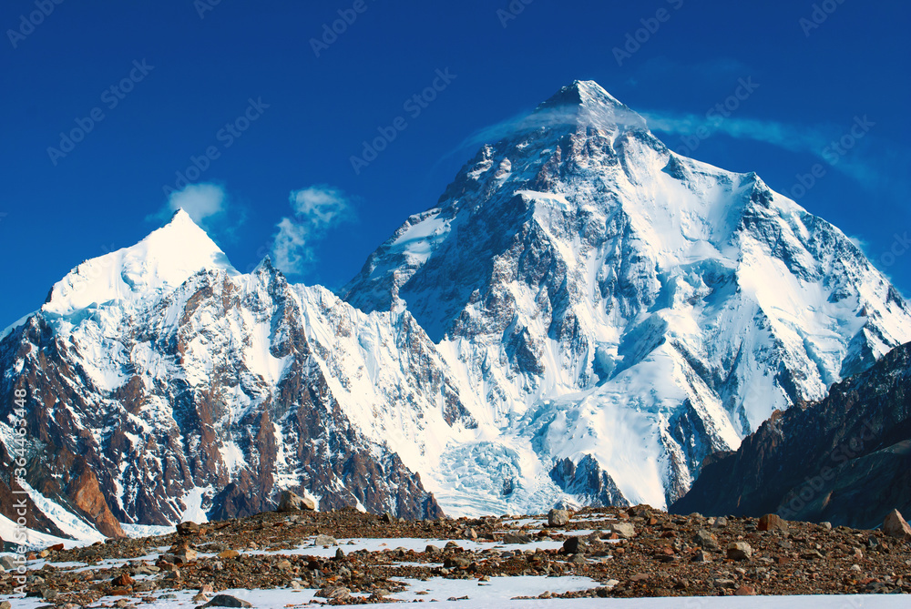 Snow peaks of mountains with Chogori K2 with blue sky. Winter tourism ...