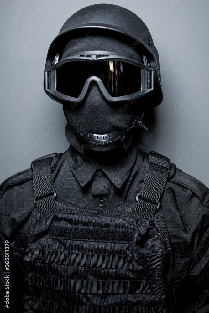 SWAT in black uniform, face mask and bulletproof vest. Russian special ...