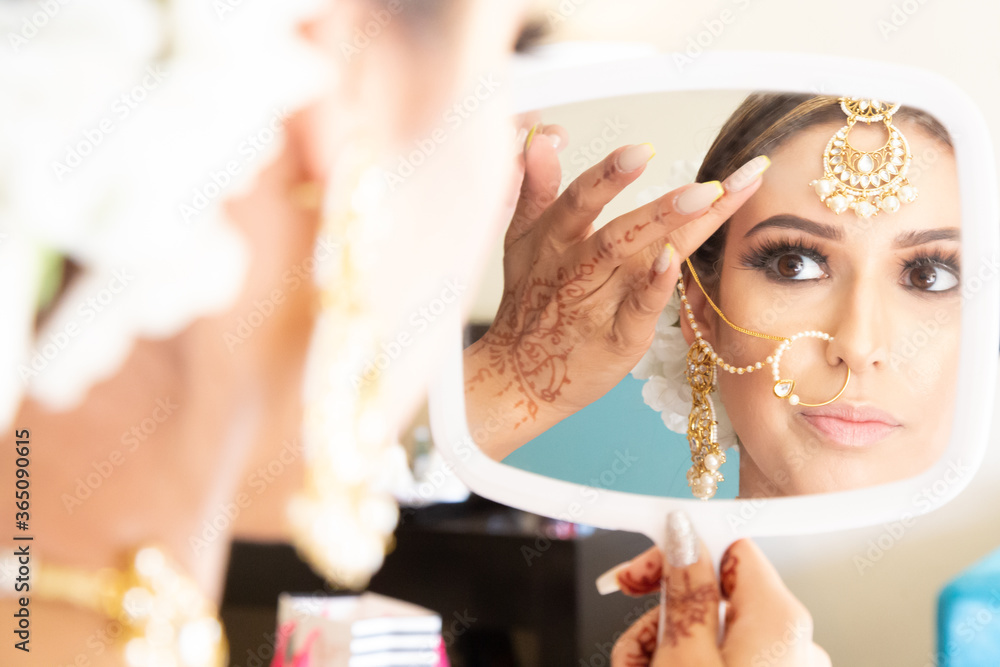 Beautiful female model wearing traditional Sikh wedding attire as she ...