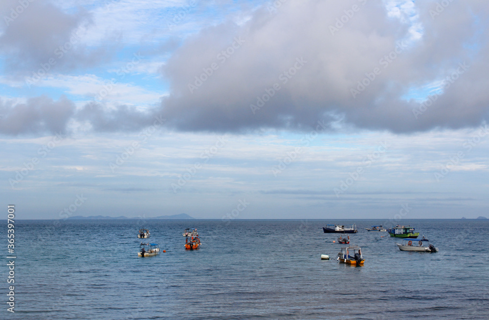 Morning view of Tioman Island with the boats floating in the sea ...