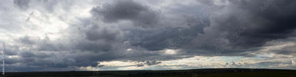 Landscape at sunset. Tragic gloomy sky. The village in the Budjak ...