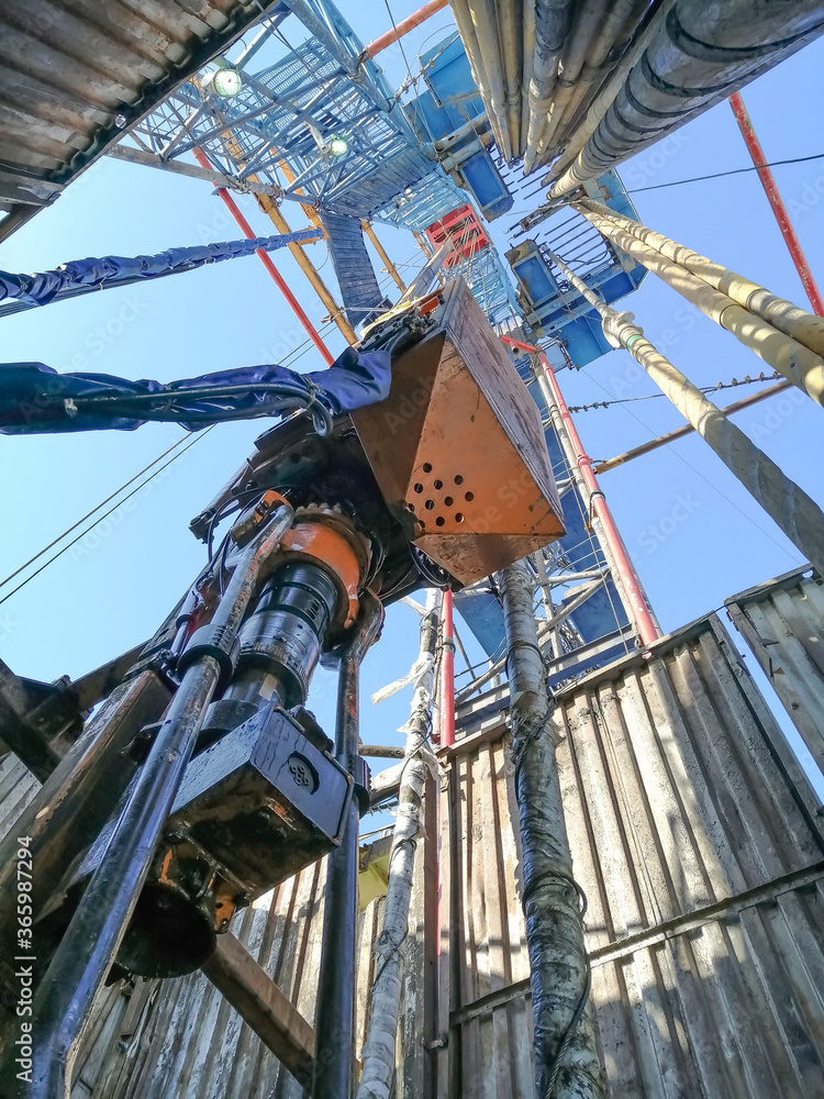 The internal structure of the drilling rig. Top power drive of drilling ...