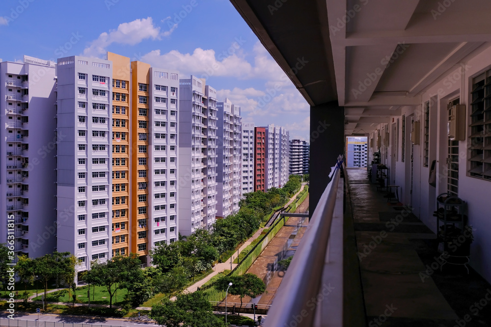 View of Singapore public housing (HDB flats) in lush green surrounding ...