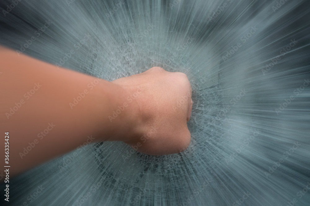 man hand punching broken glass Stock Photo | Adobe Stock