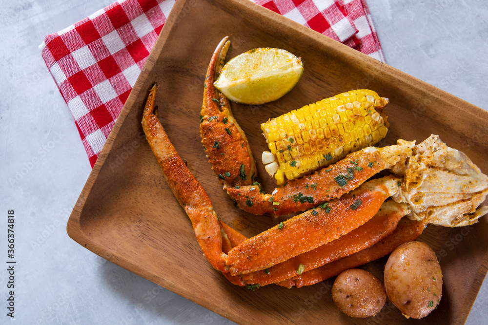 Platter of southern garlic crabs seafood boil with Alaskan crab legs ...