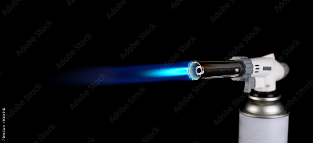 Flamethrower burner gas blow torch Ignition with blue fire flame at ...
