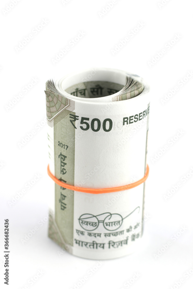 Indian currency notes of various denominations. A bundle of 500 Rupees ...