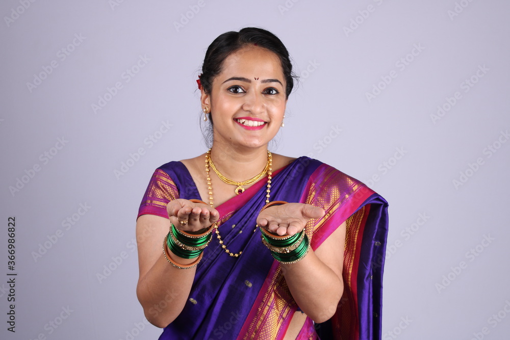 Beautiful Indian girl wearing sari showing hand gestures. Stock Photo ...