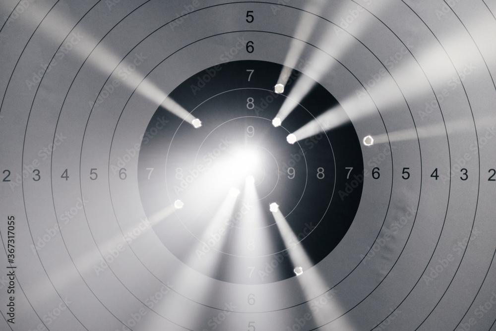 Shooting target with light coming out of holes Stock Photo | Adobe Stock