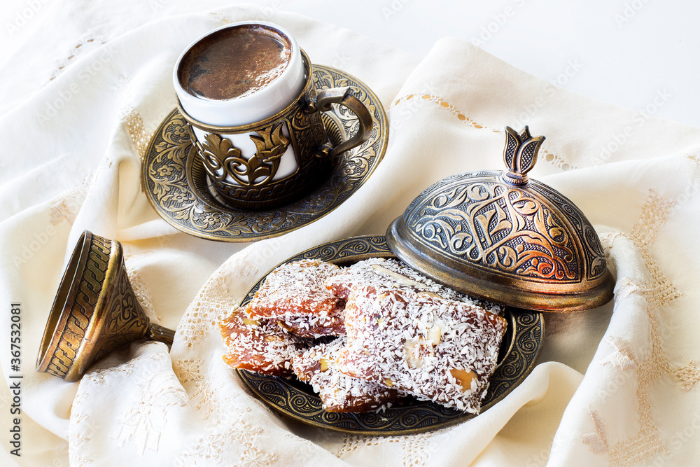 Turkish coffee with traditional turkish dessert cezerye and copper ...
