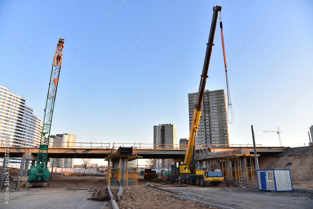 Mobile telescopic boom crane on bridge construction. Truck Crane work ...
