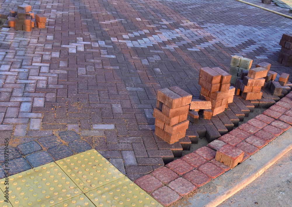 Process of installing paving bricks in the town pedestrian zone. Laying ...