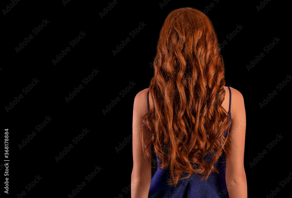 Beautiful young redhead woman on dark background, back view Stock Photo ...