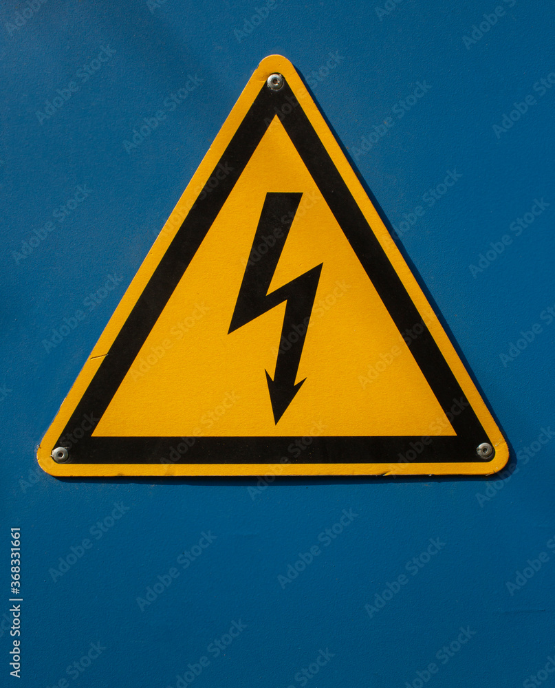 High voltage sign with lightning on a blue background. Danger high ...