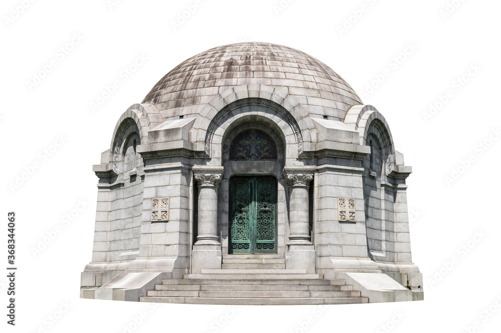 Dome-shaped stone mausoleum with Christian symbols and wrought-iron ...