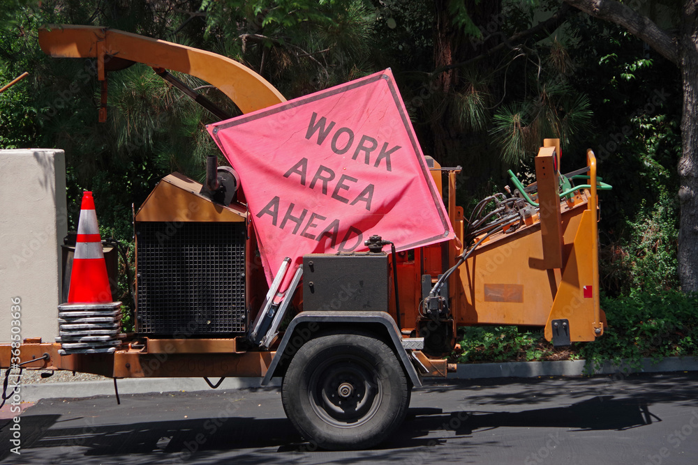 Photo Stock A wood shredder trailer loaded with equipment and a WORK ...