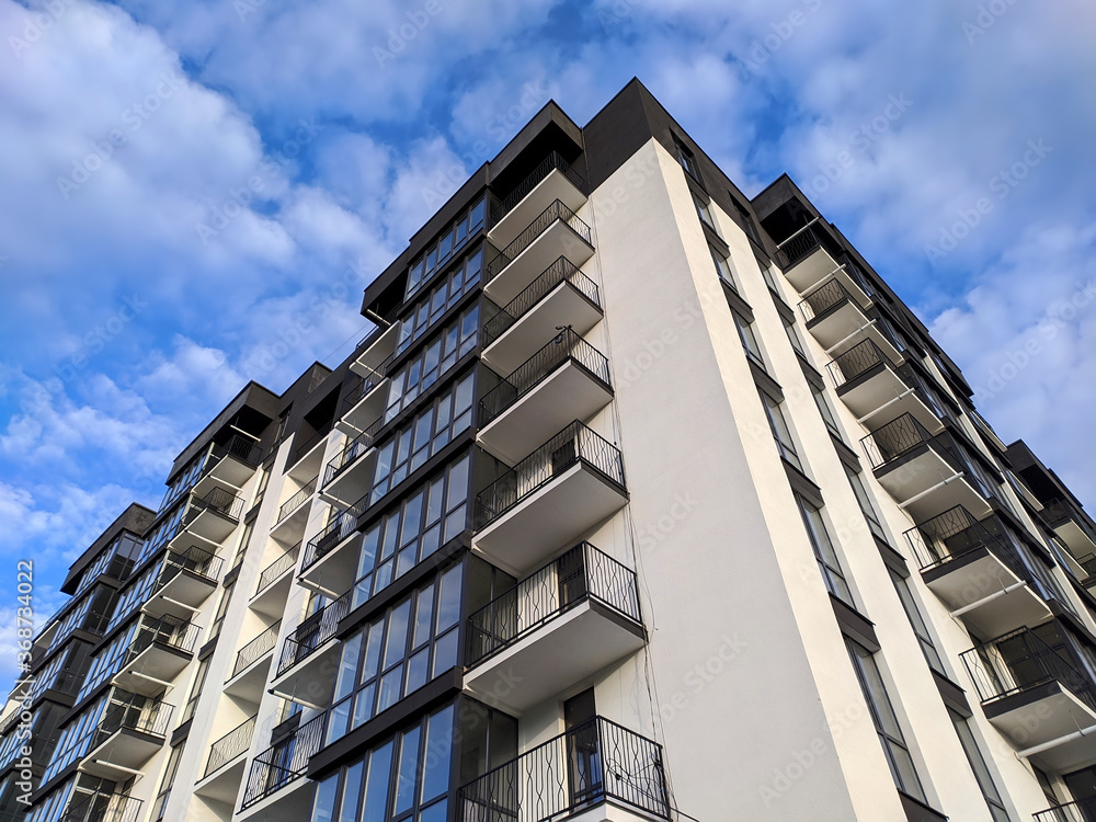 new apartment building on sky background Stock Photo | Adobe Stock