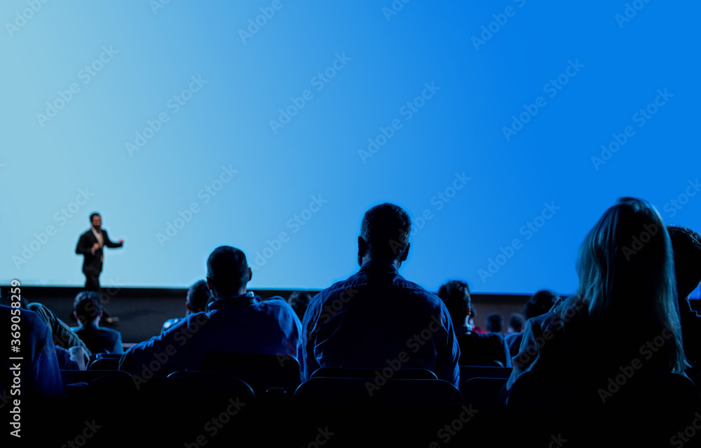 Business or Academic Conference Event. Audience engaged and looking ...