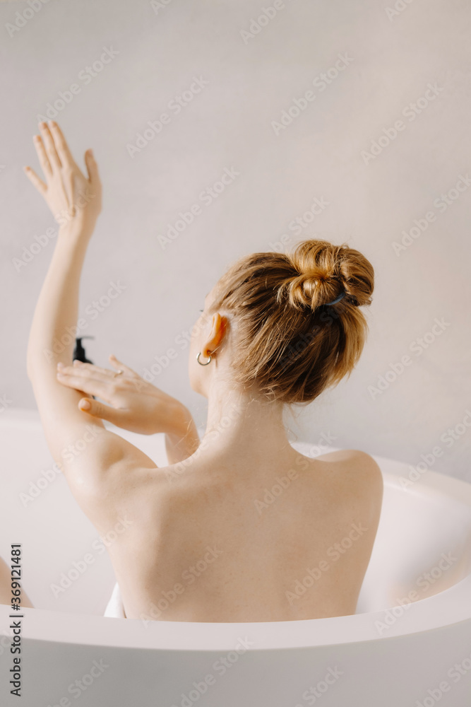 Beautiful young woman doing her bath rituals Stock Photo | Adobe Stock