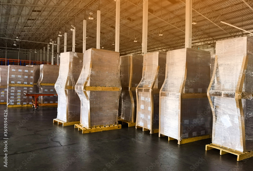 Worker driving forklift loading and unloading shipment carton boxes and ...