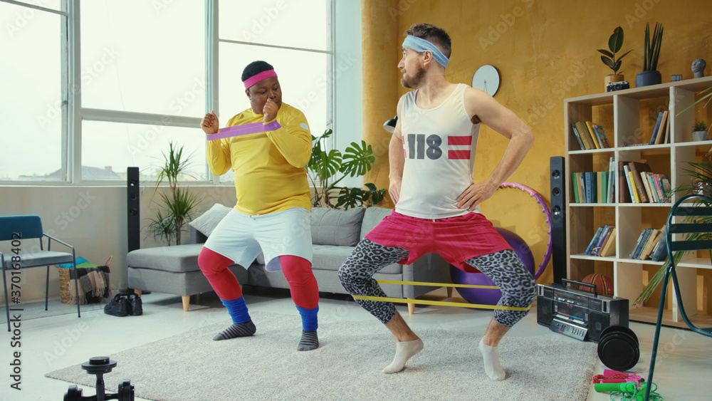 Sports parody. Comical funny unfit retro looking young men training ...