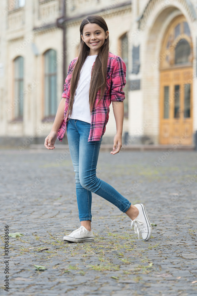 Grow naturally. Happy girl child outdoors. Little child in casual style ...