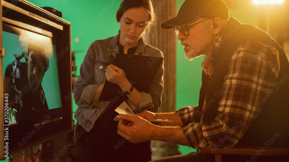 Director Looks at Display and Compares to Storyboard while Shooting ...