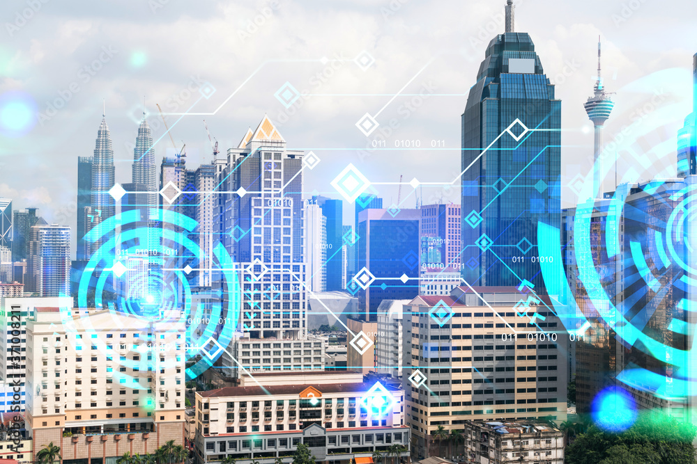 Technology hologram over panorama city view of Kuala Lumpur. KL is the ...