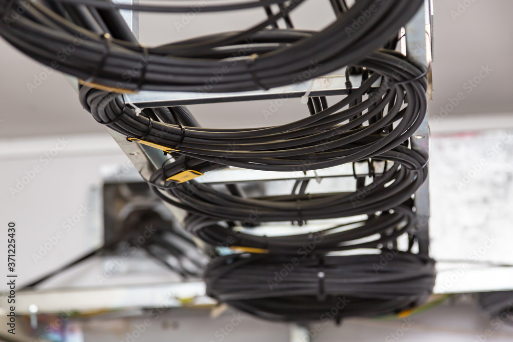 Foto de Stock Cable management. Working wires, black cables wound into ...