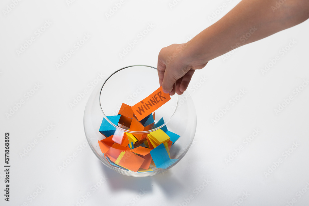 Child hand picking winner from a glass bowl, random name ballot, simple ...
