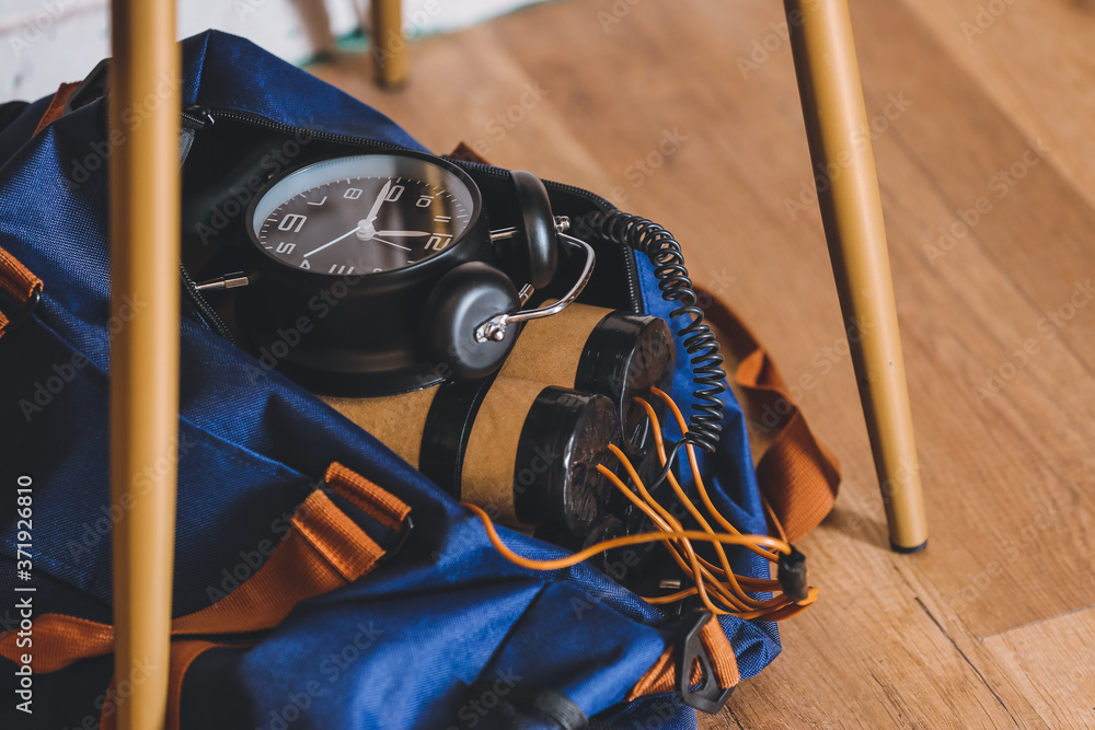 Bag with bomb under chair Stock Photo | Adobe Stock