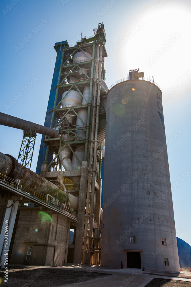 Mynaral, Kazakhstan: Jambyl Cement plant. Silhouette of main cement ...