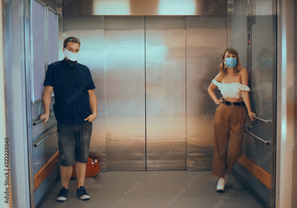 Girls and guy ride in the elevator. Students go to study. People in the elevator. Elevator with ...