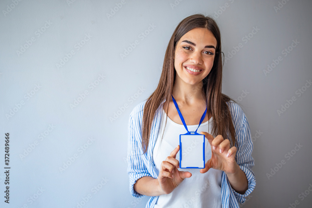 Woman wear blank vertical ID badge mockup, stand isolated. Name tag on ...