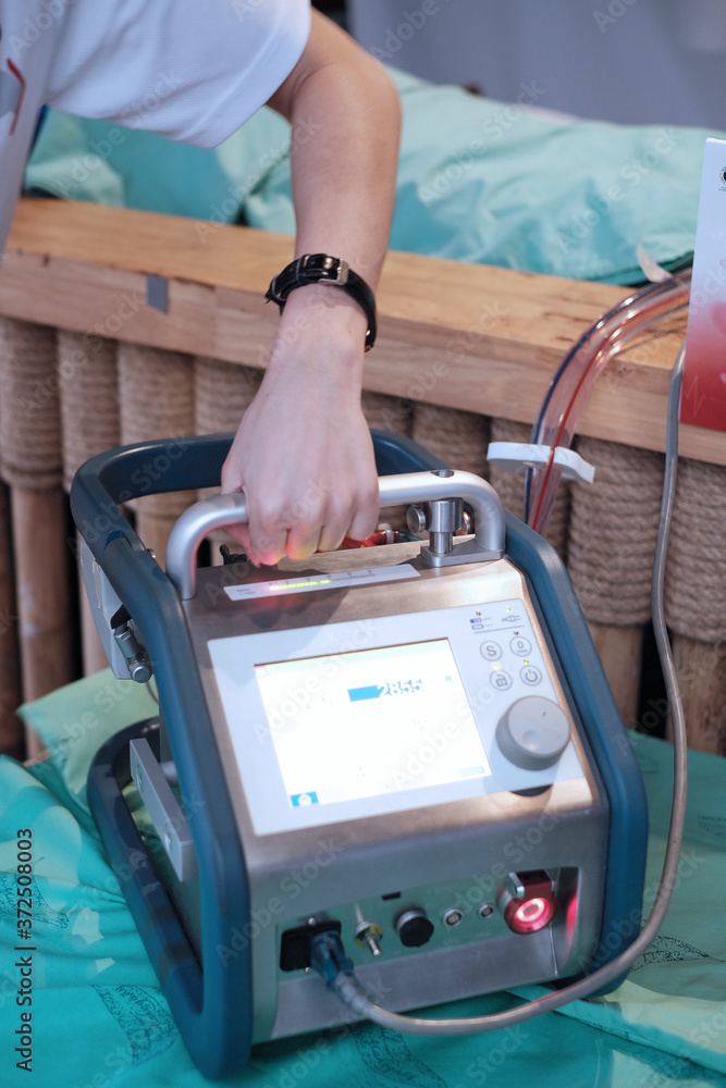 Hand holding portable extracorporeal membrane oxygenation (ecmo ...